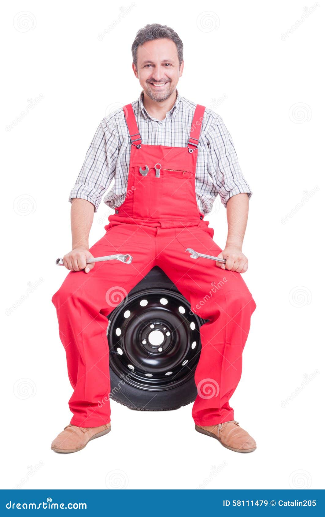 Friendly Mechanic Sitting on Car Wheel Stock Image - Image of ...