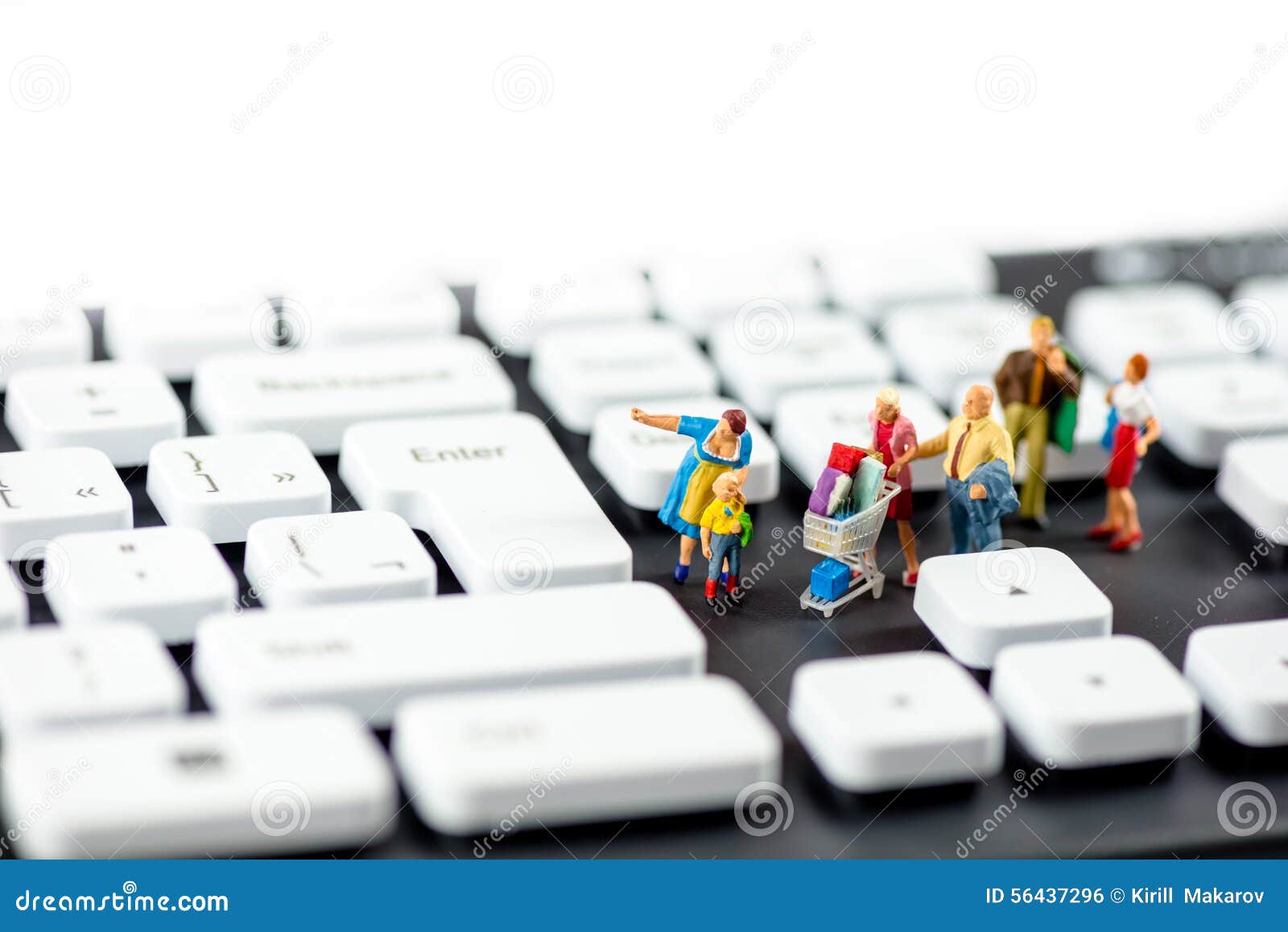 Friendly Miniature Family Looking at Computer Keyboards. Technology ...