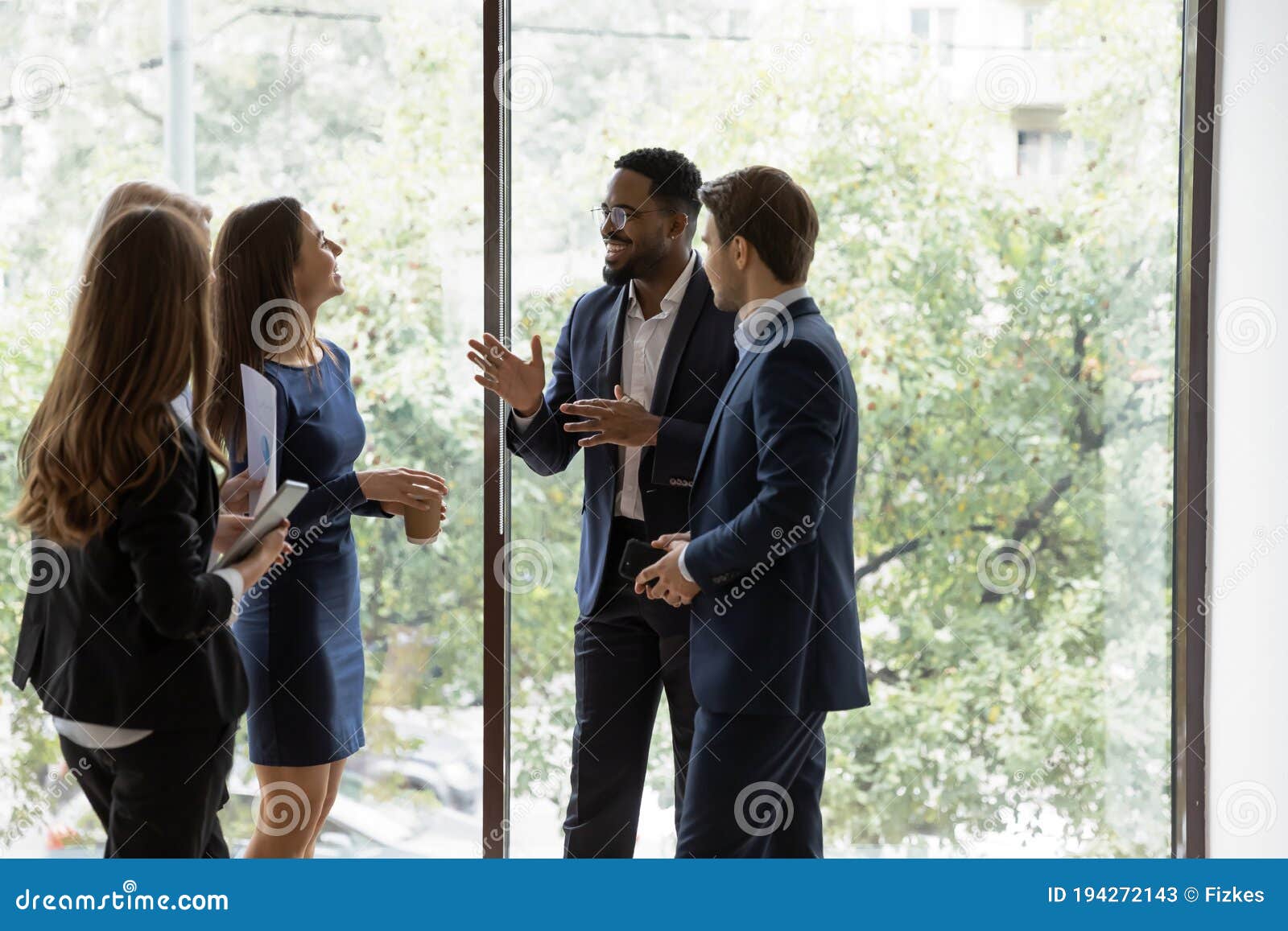 Friendly Multiracial Colleagues Chatting at Coffee Break Stock Image ... Friendly Multiracial Colleagues Chatting at Coffee Break Stock Image ...