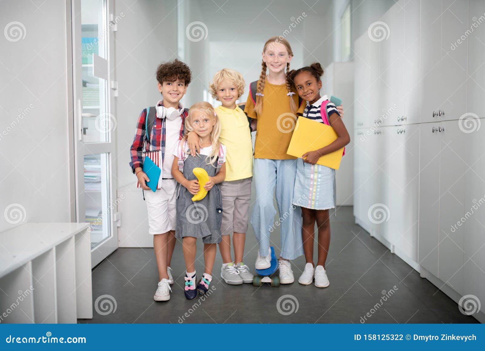 Friendly Pleasant Pupils Hugging Each Other Stock Photo - Image of ...