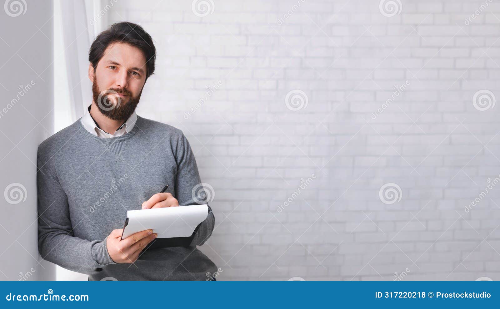 Friendly Psychologist Standing with Clipboard, Leaning at Wall Stock ...