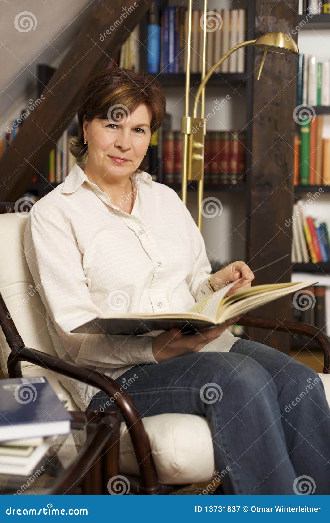 Friendly Senior Woman Sitting and Reading a Book Stock Image - Image of ...