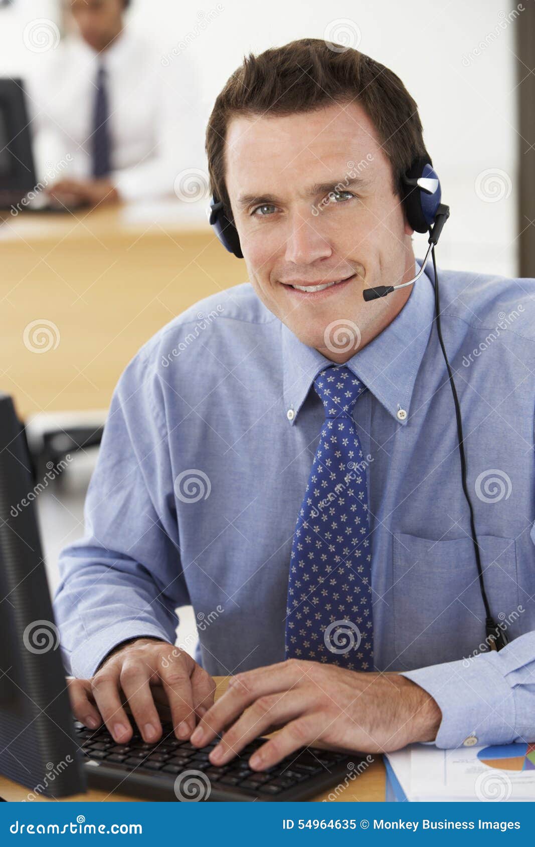 Friendly Service Agent Talking To Customer in Call Centre Stock Image ...