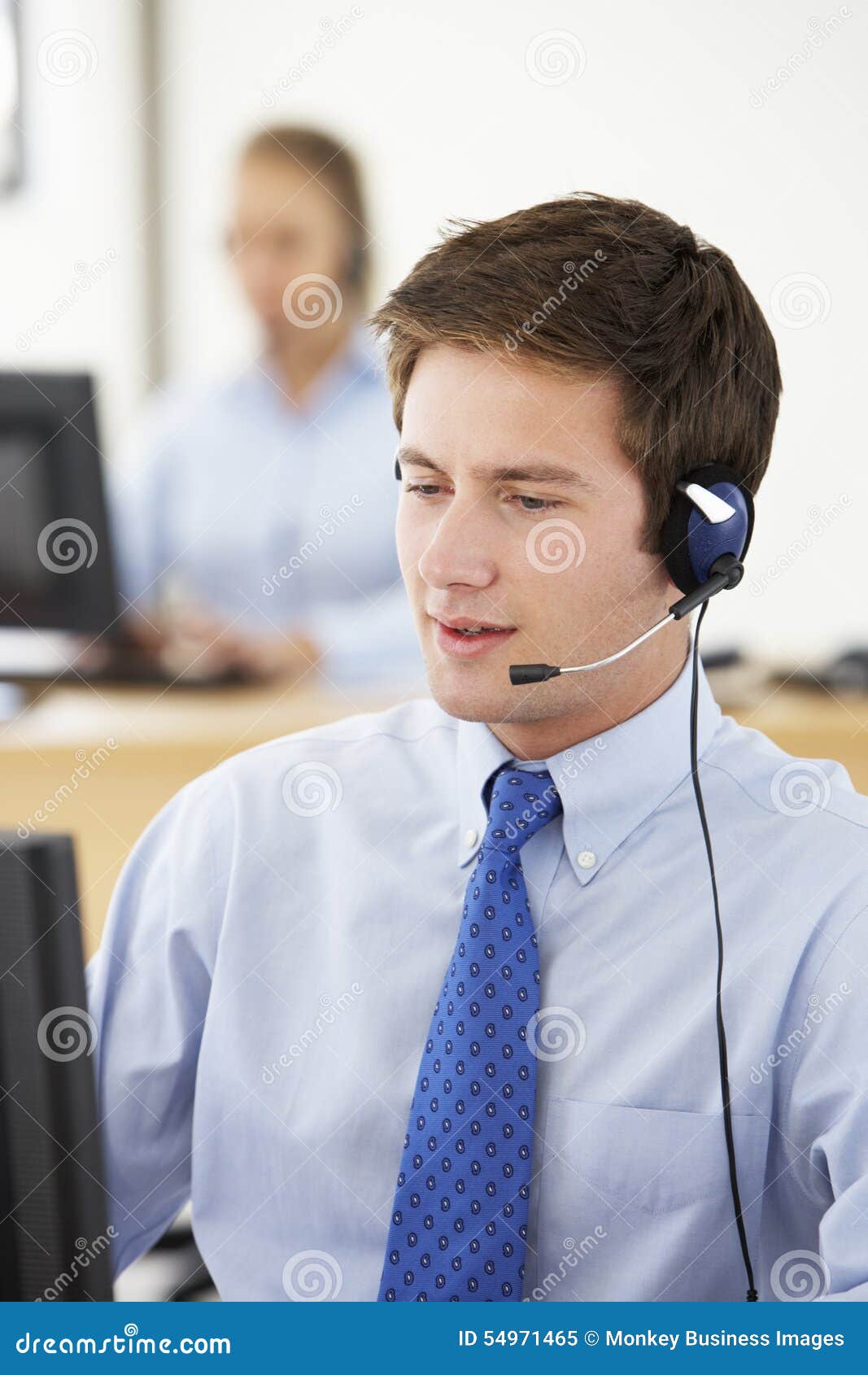 Friendly Service Agent Talking To Customer in Call Centre Stock Image ...