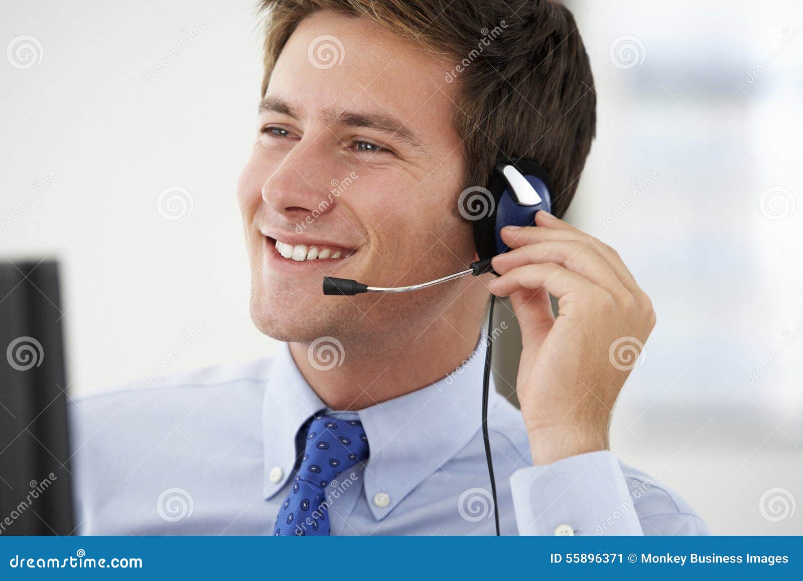 Friendly Service Agent Talking To Customer in Call Centre Stock Image ...