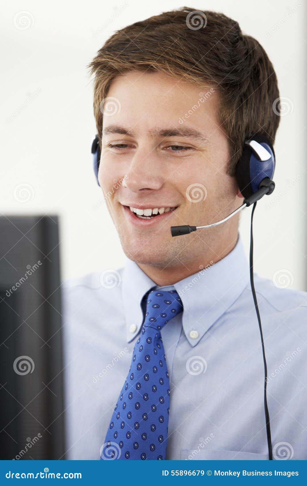 Friendly Service Agent Talking To Customer in Call Centre Stock Image ...