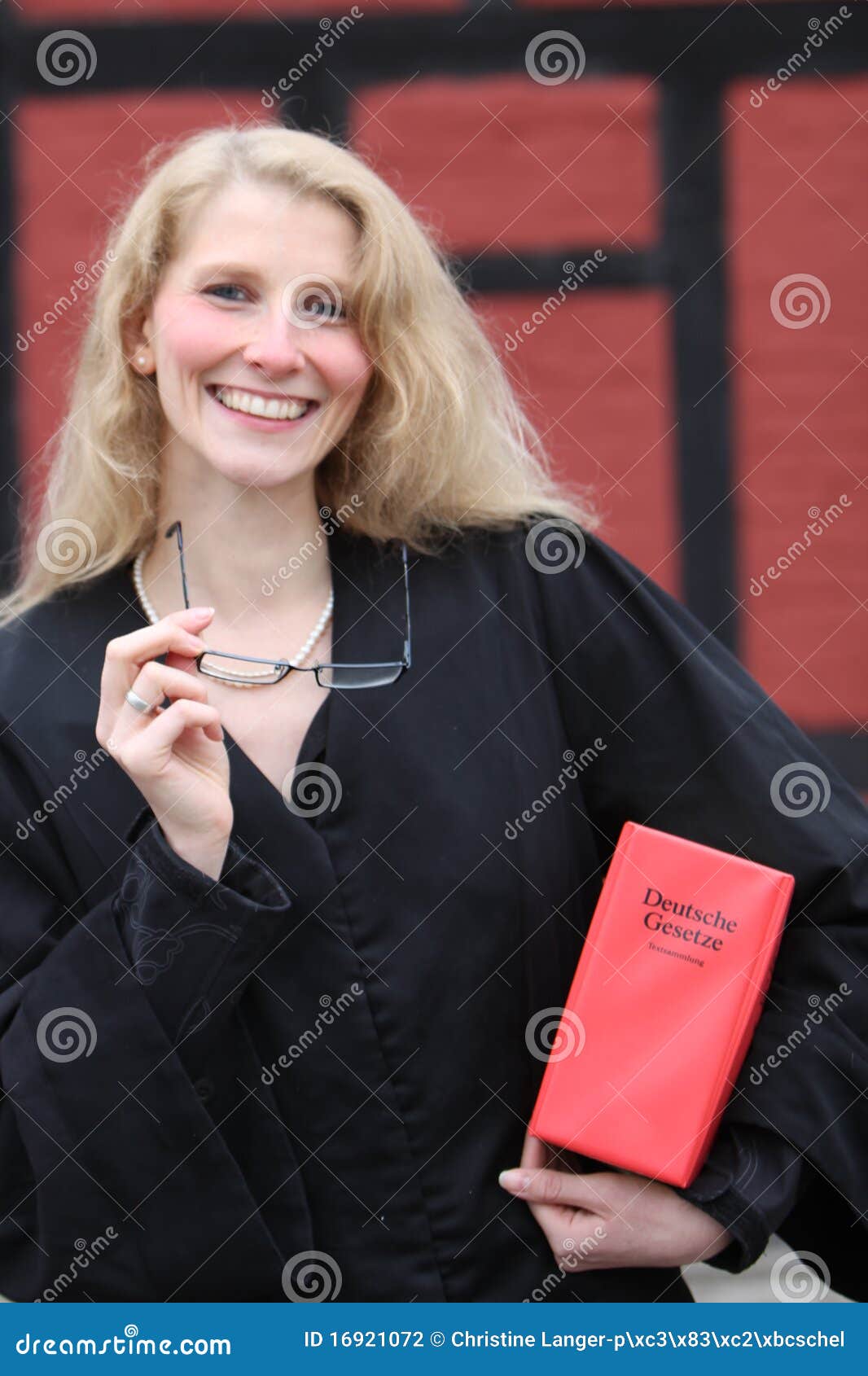 Friendly Smiling Lawyer with Red Law Book Under H Stock Photo - Image ...