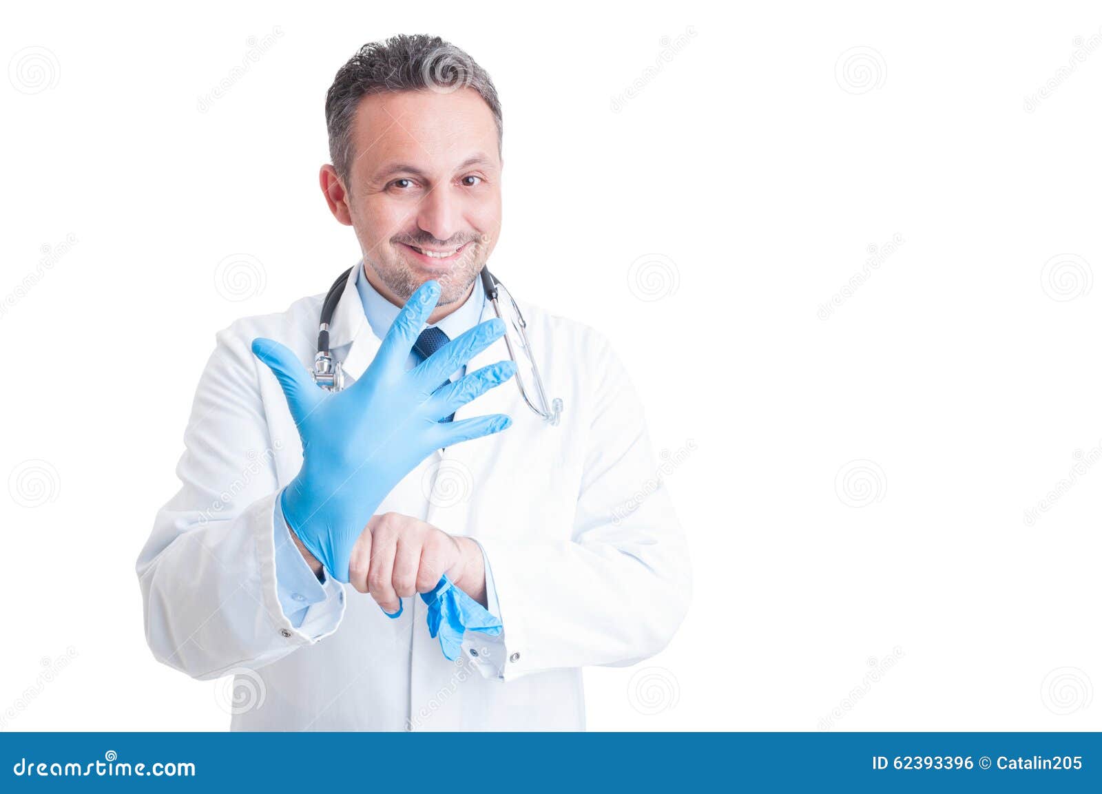 Friendly Smiling Medic or Doctor Pulling Blue Latex Gloves Stock Photo ...
