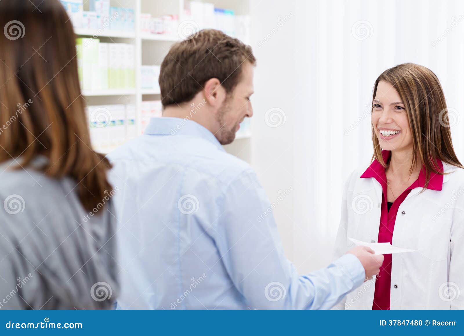 Friendly Smiling Pharmacist Helping a Customer Stock Photo - Image of ...