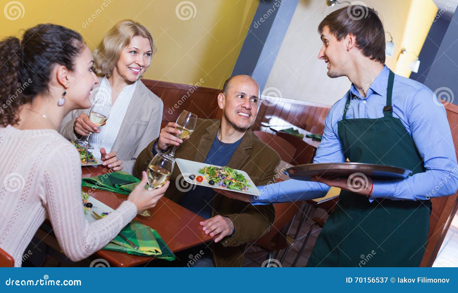 Friendly Smiling Waiter Taking Order at Table of People Stock Image ...