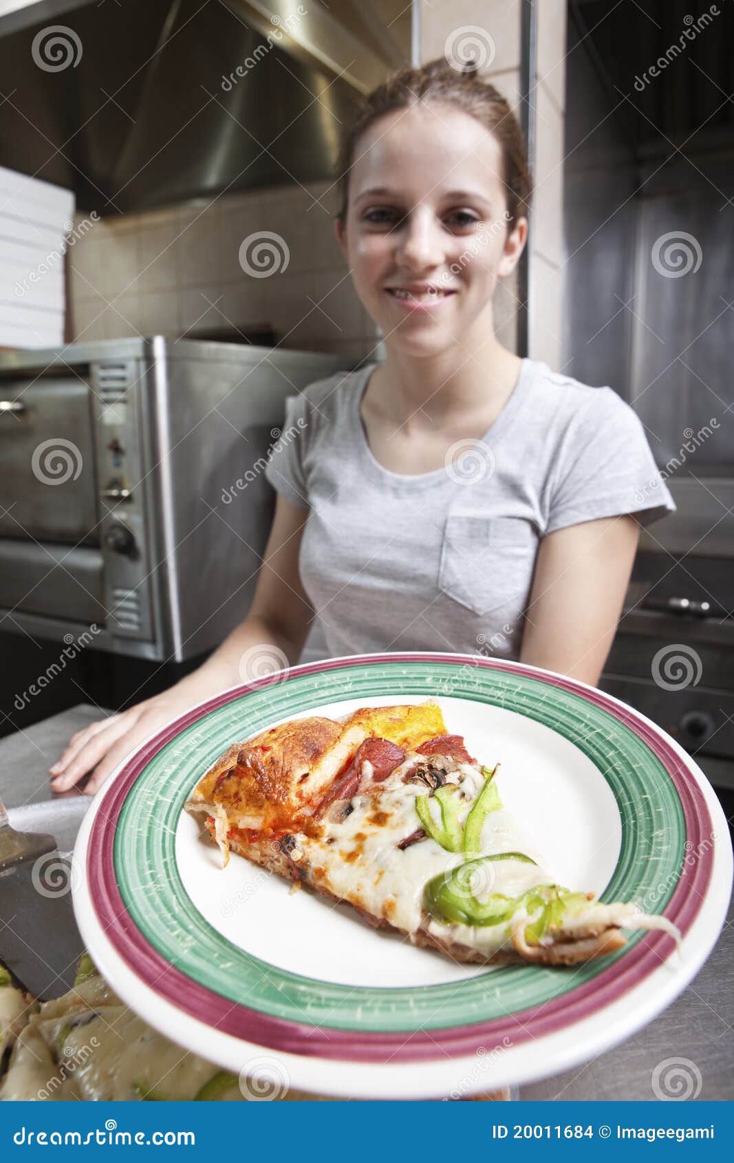 Friendly Smiling Waitress Serving a Slice of Pizza Stock Photo - Image ...