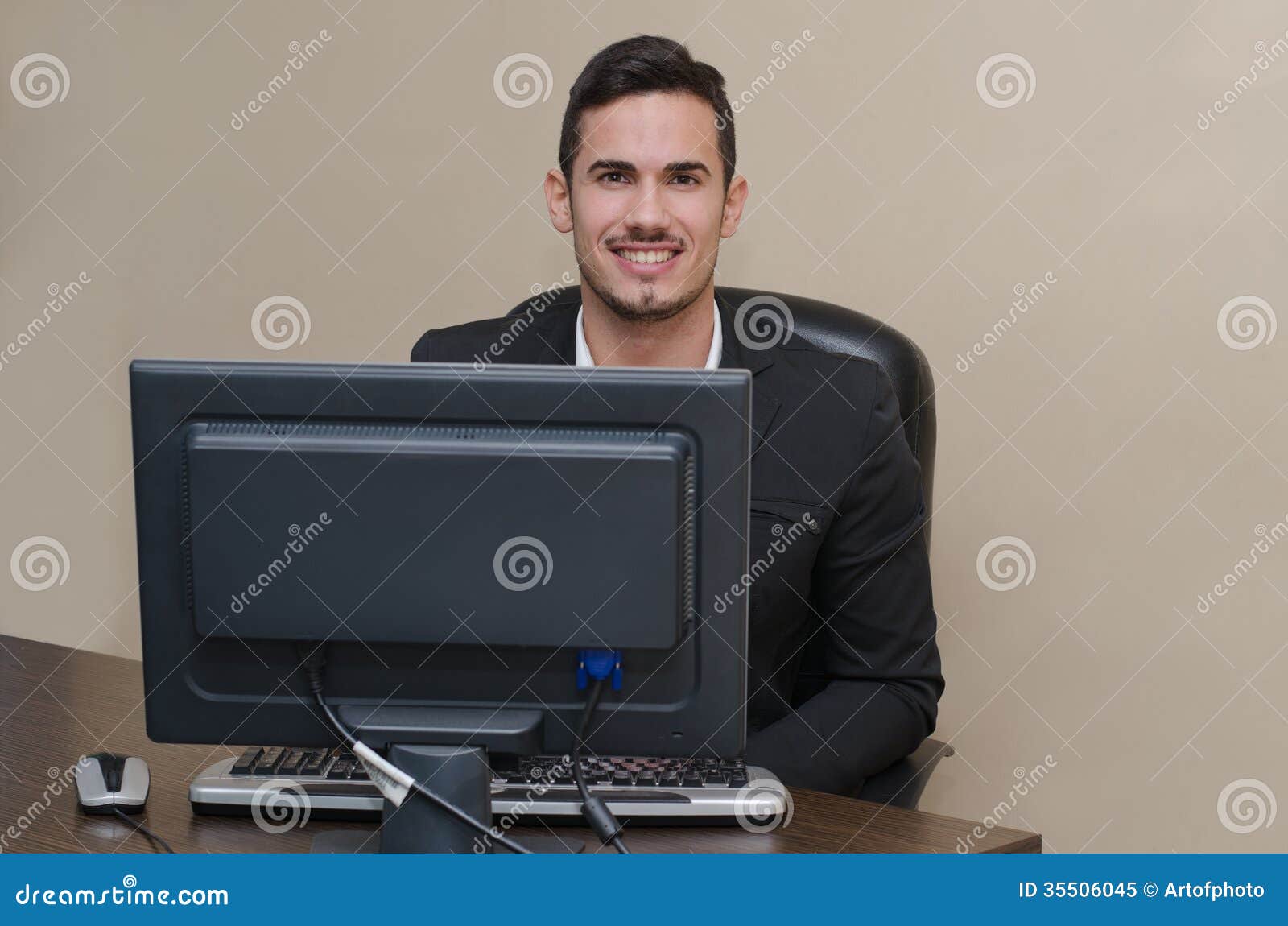Friendly, Smiling Young Businessman Sitting at Desk Stock Image - Image ...