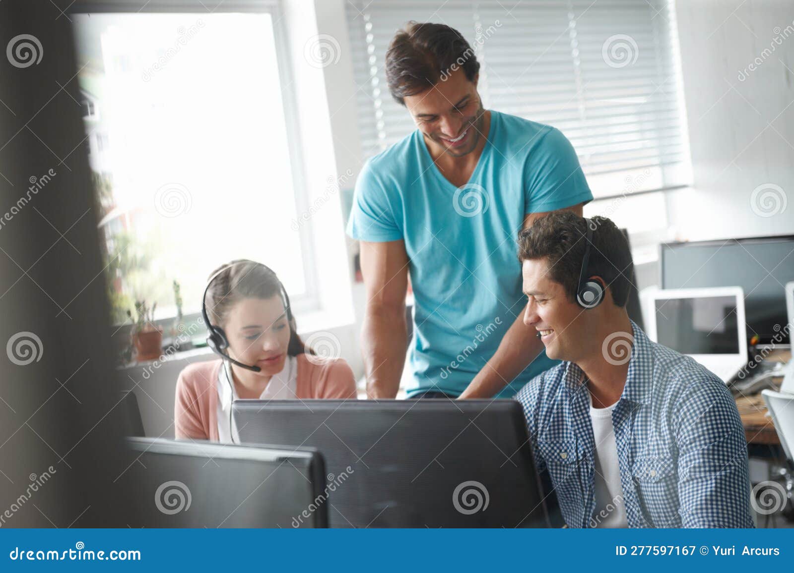 Friendly Supervision. a Handsome Man Standing in an Office and Smiling ...