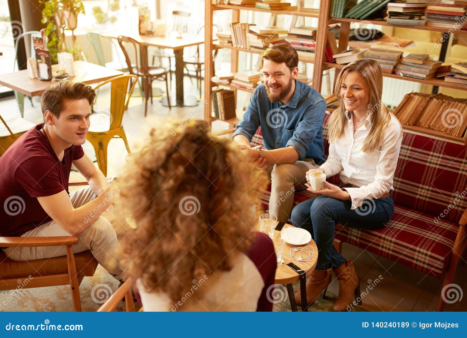 Friendly talk in cafe stock image. Image of chat, coffee - 140240189