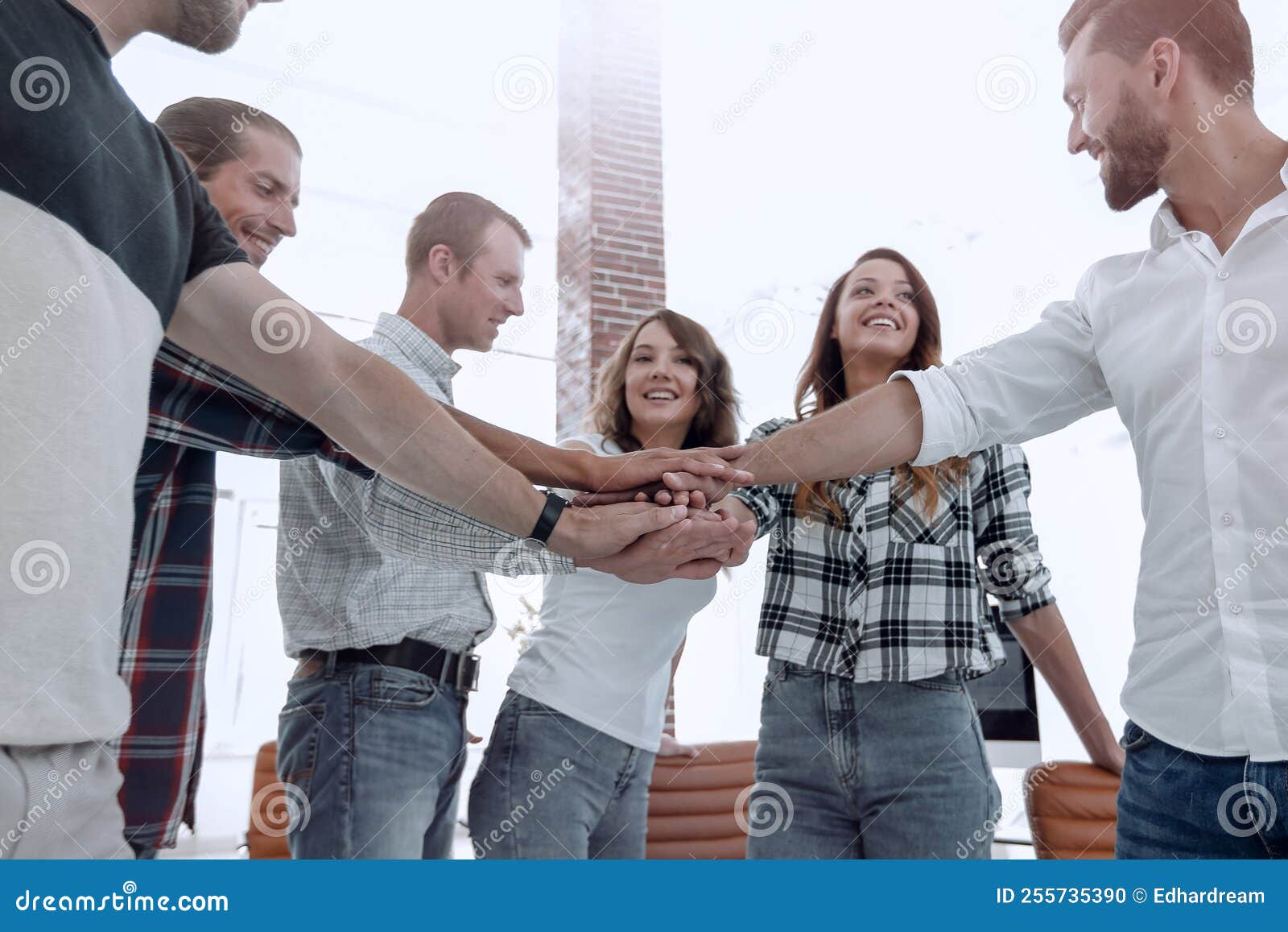 .friendly Team of Designers Clasped Their Palms Together Stock Photo ...