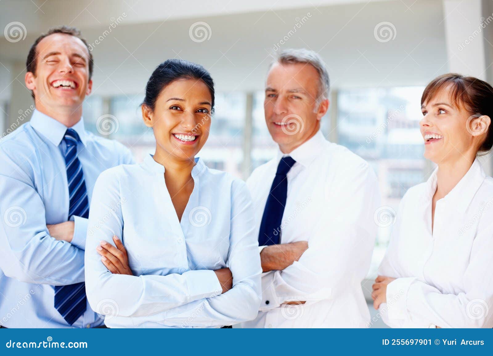 Friendly Team of Professionals. Professionals Laughing while at Work ...