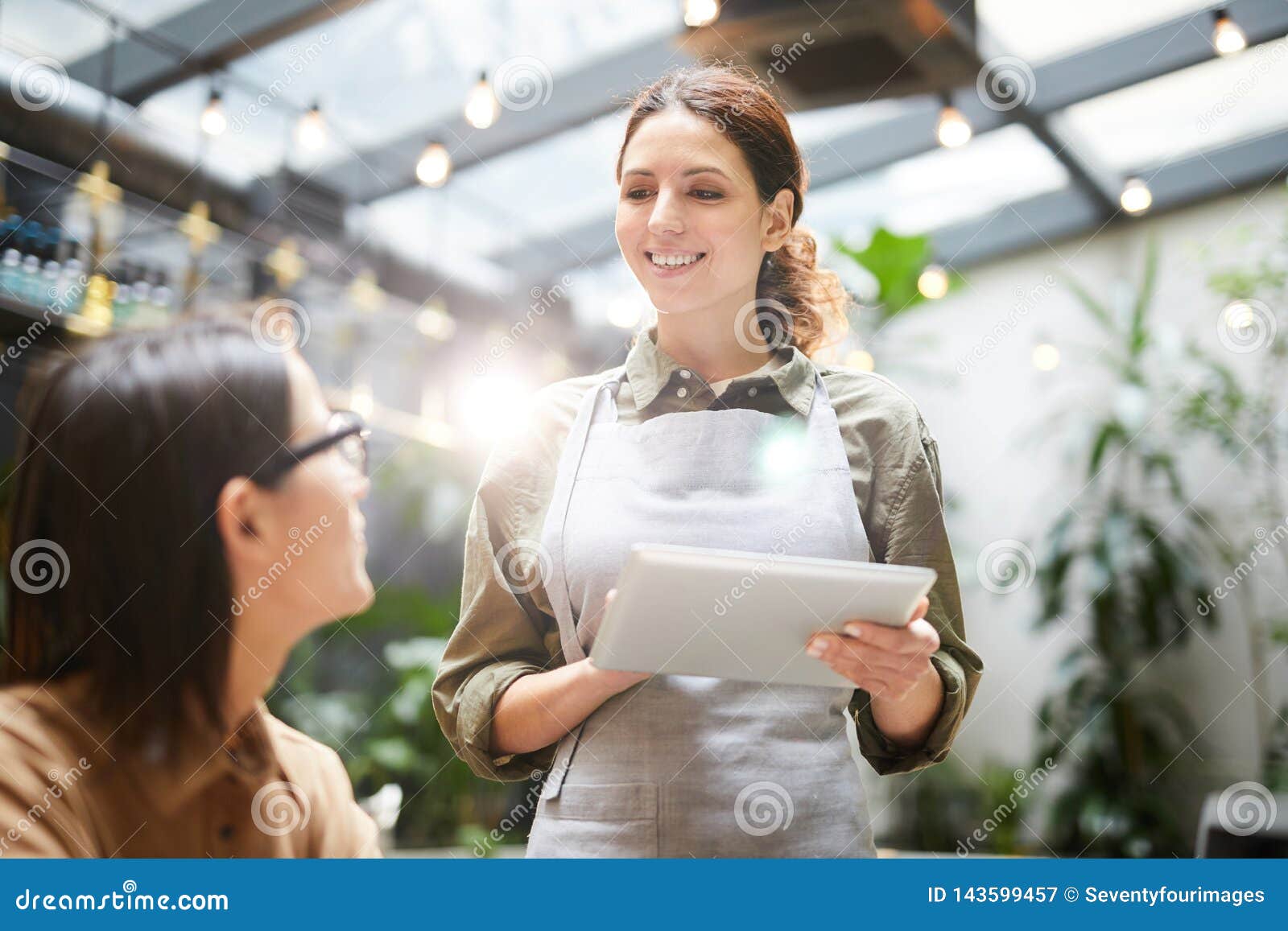 Friendly Waitress Using Tablet To Take Order Stock Image - Image of ...