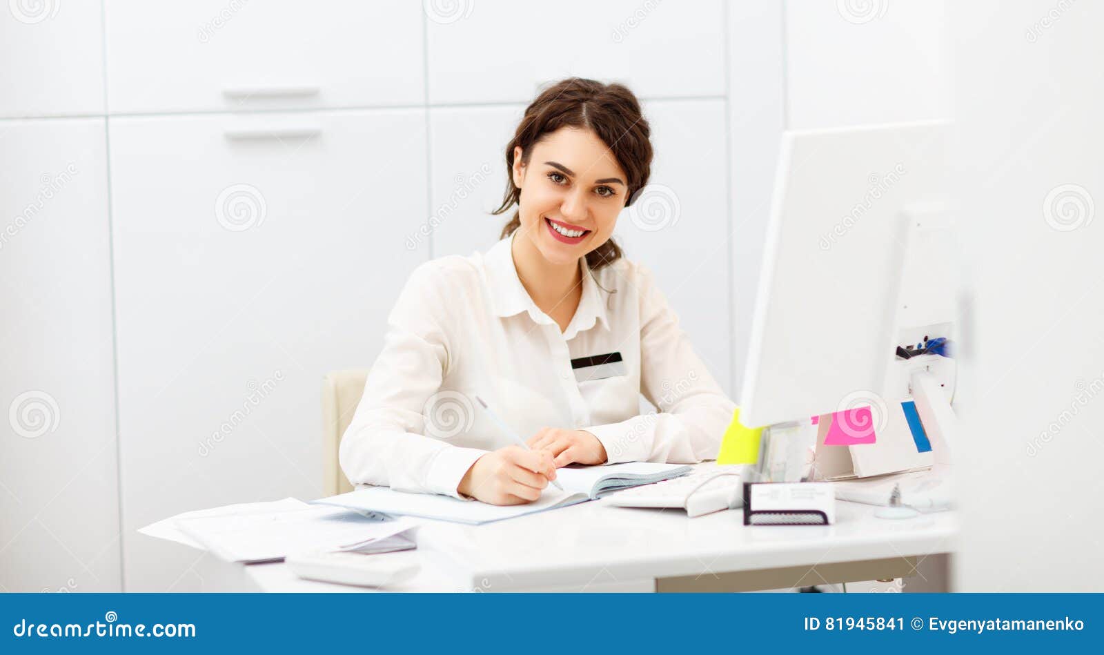 Man At Reception Desk With Young Staff Pointing Left Royalty-Free Stock ...