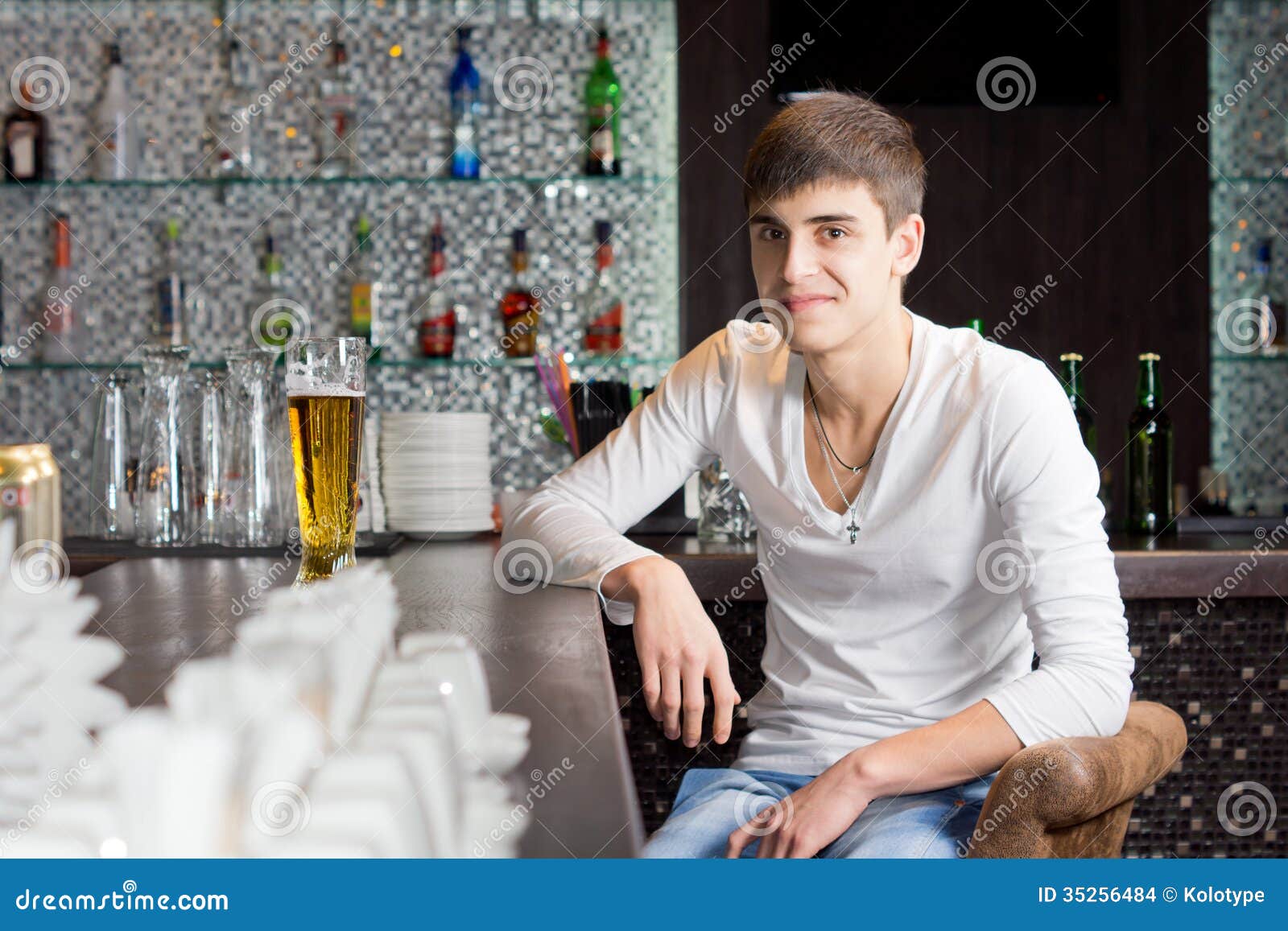 Friendly Young Man Drinking in a Bar Stock Photo - Image of ...