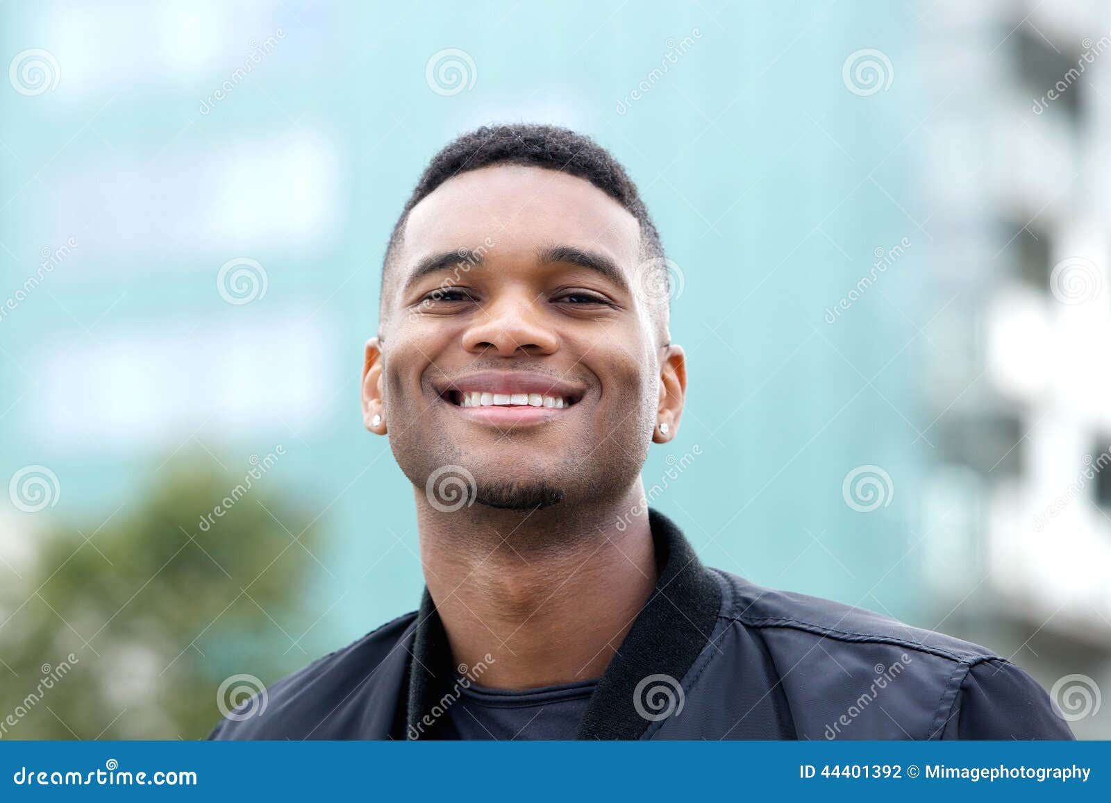 Friendly Young Man Smiling Outdoors Stock Photo - Image of expression ...