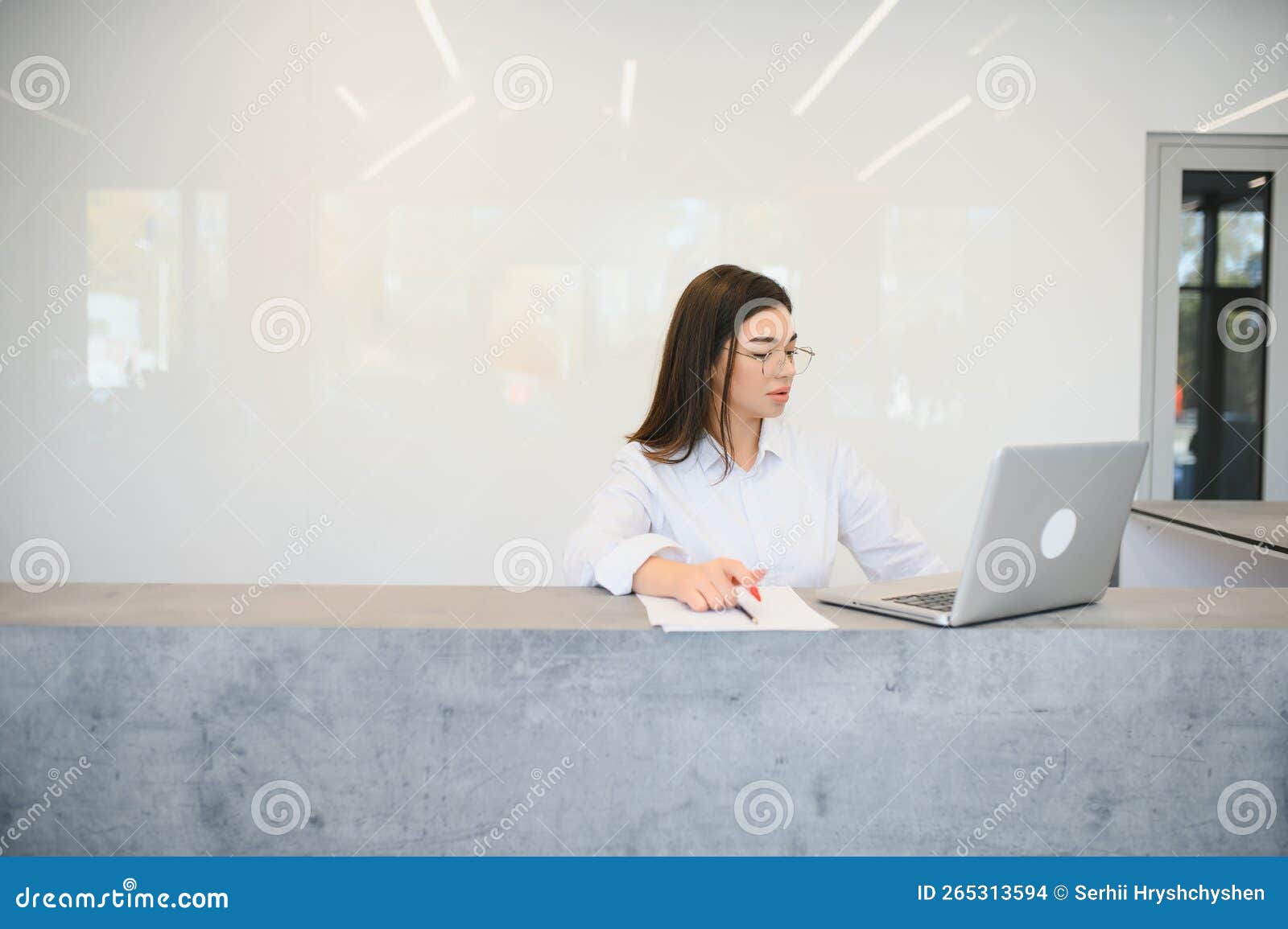 Friendly Young Woman Behind the Reception Desk Administrator Stock ...