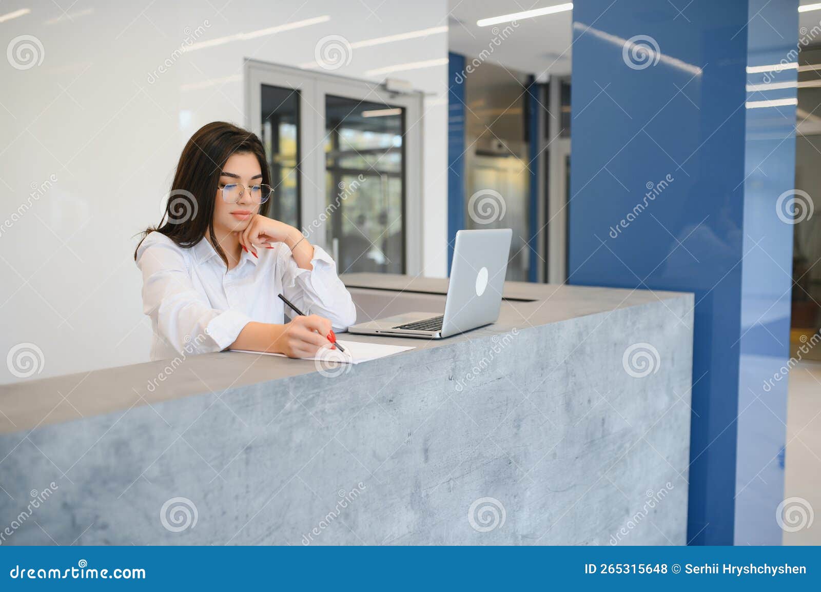 Friendly Young Woman Behind the Reception Desk Administrator Stock ...
