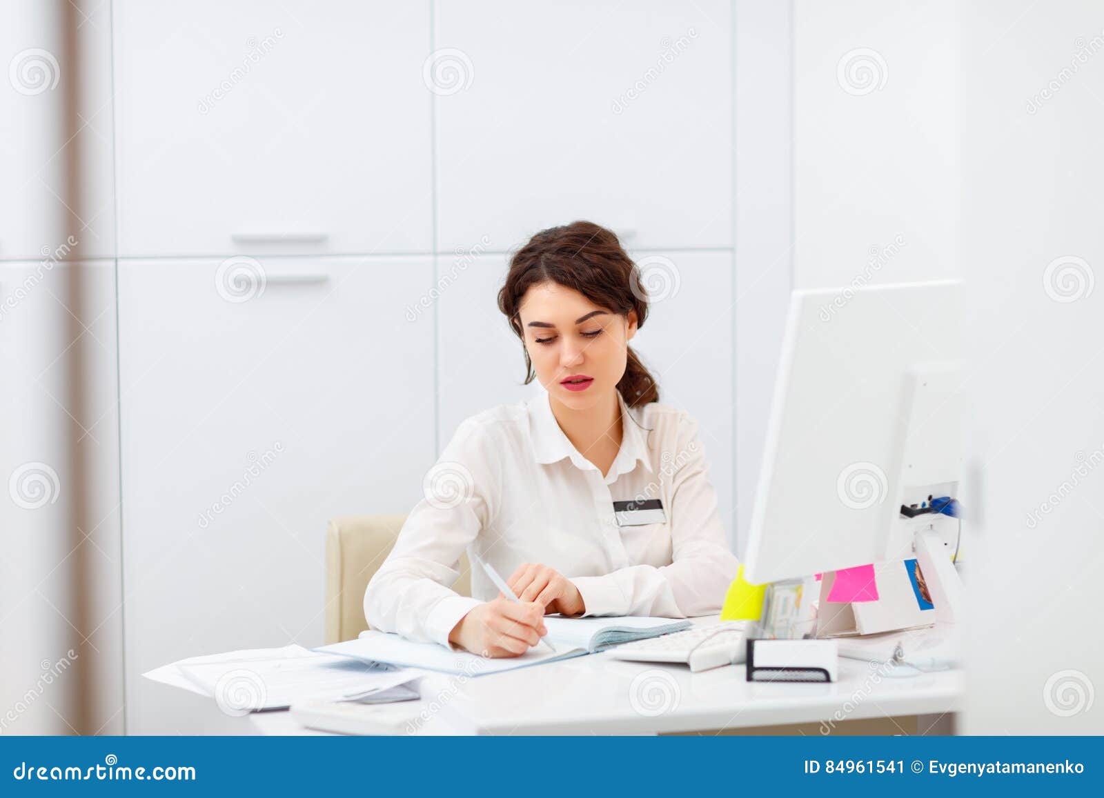 Friendly Young Woman Behind Reception Desk Administrator Stock Image ...