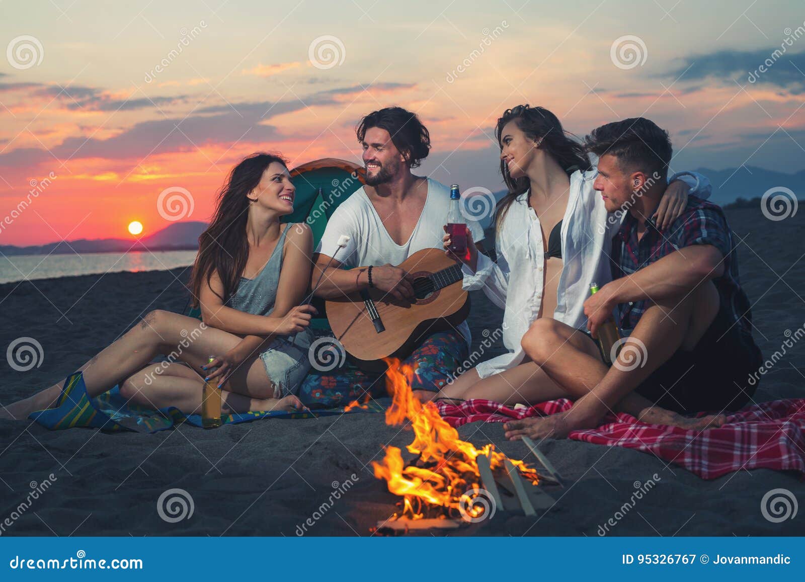 Friends Around the Fire in Sunset on Beach Stock Image - Image of ...