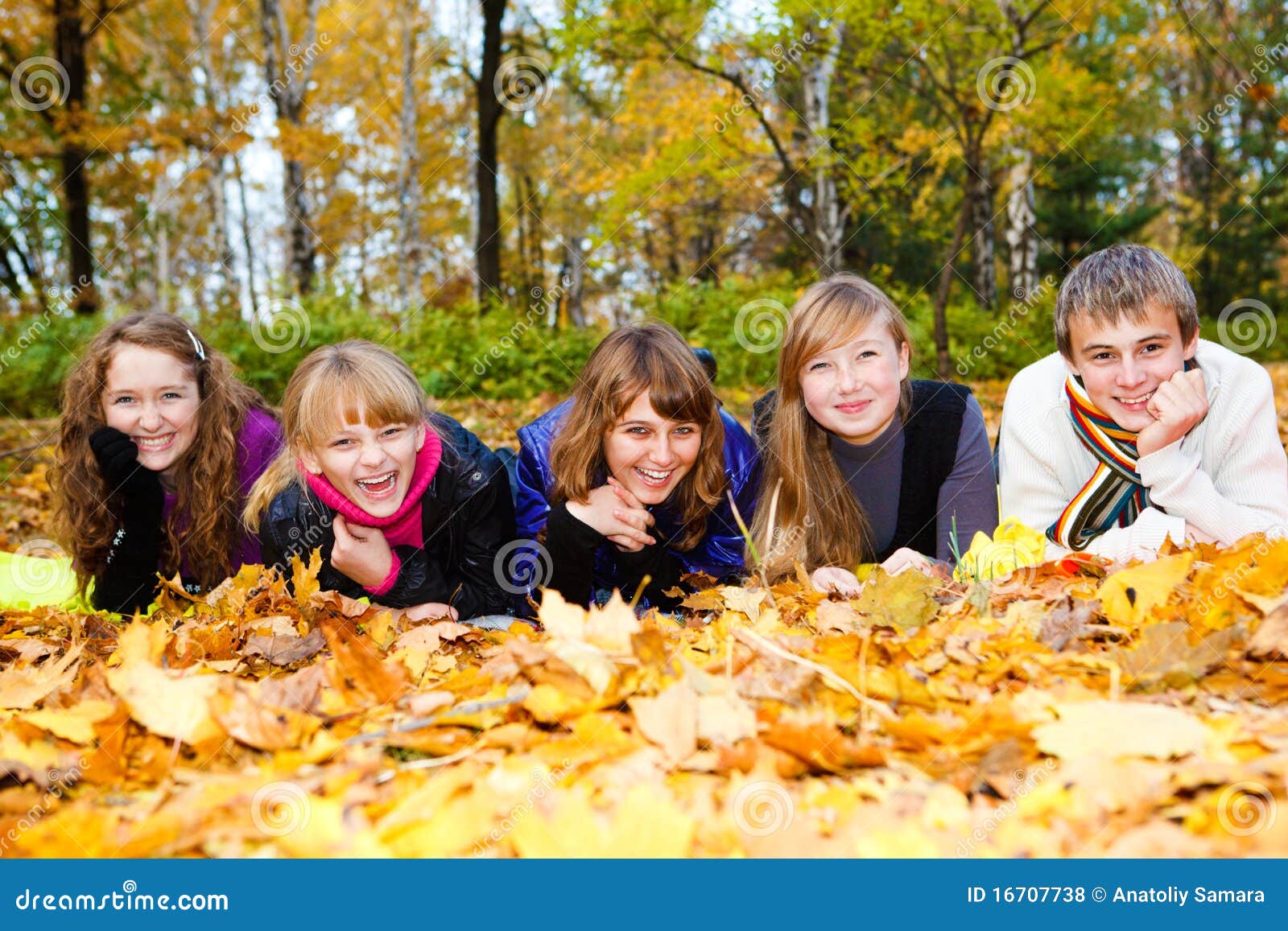 Friends on autumn leaves stock photo. Image of casual - 16707738