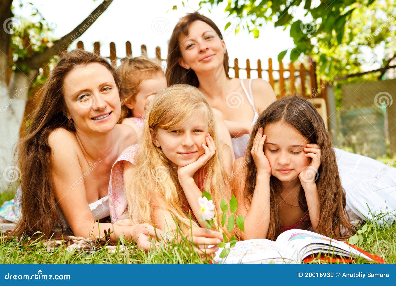 Friends in the backyard stock image. Image of lying, generation - 20016939