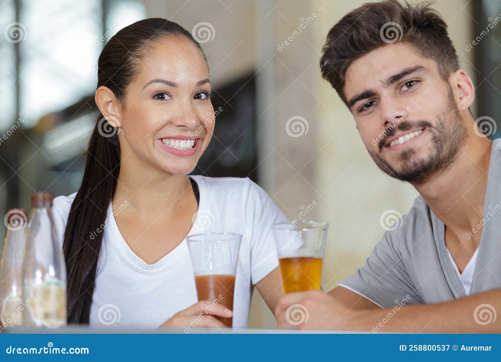 Friends in Bar Drinking Beer Toasting Stock Image - Image of camera ...