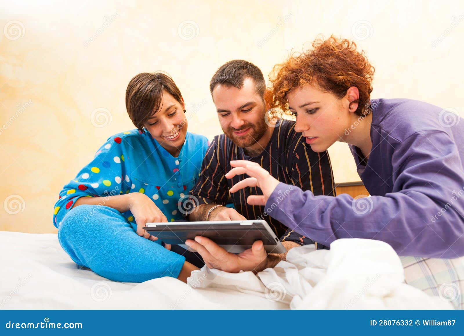 Friends on the Bed stock photo. Image of indoor, tablet - 28076332
