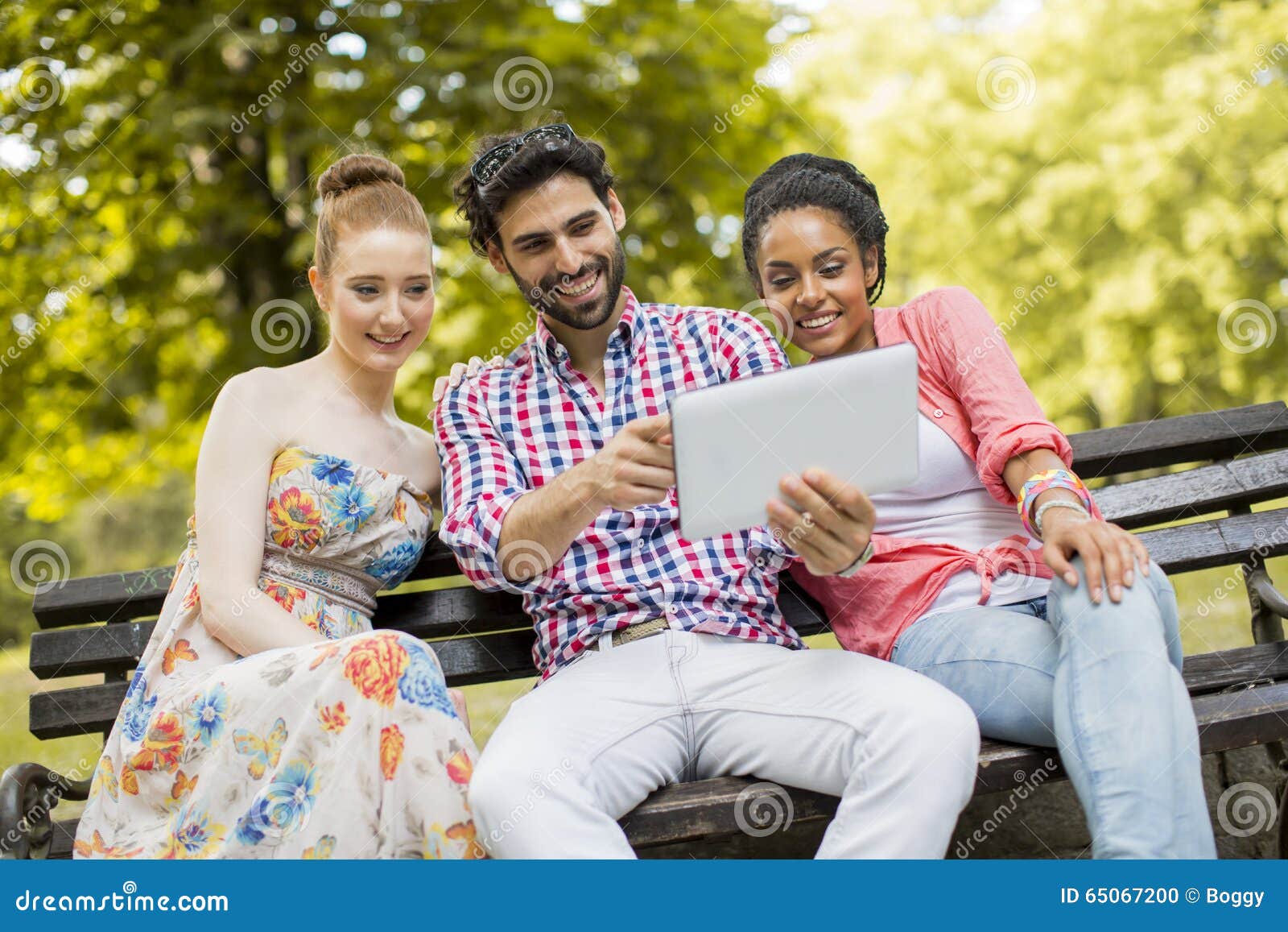 Friends on the Bench with Tablet Stock Photo - Image of group ...