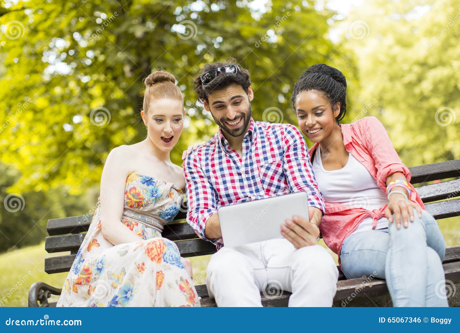 Friends on the Bench with Tablet Stock Photo - Image of attractive ...