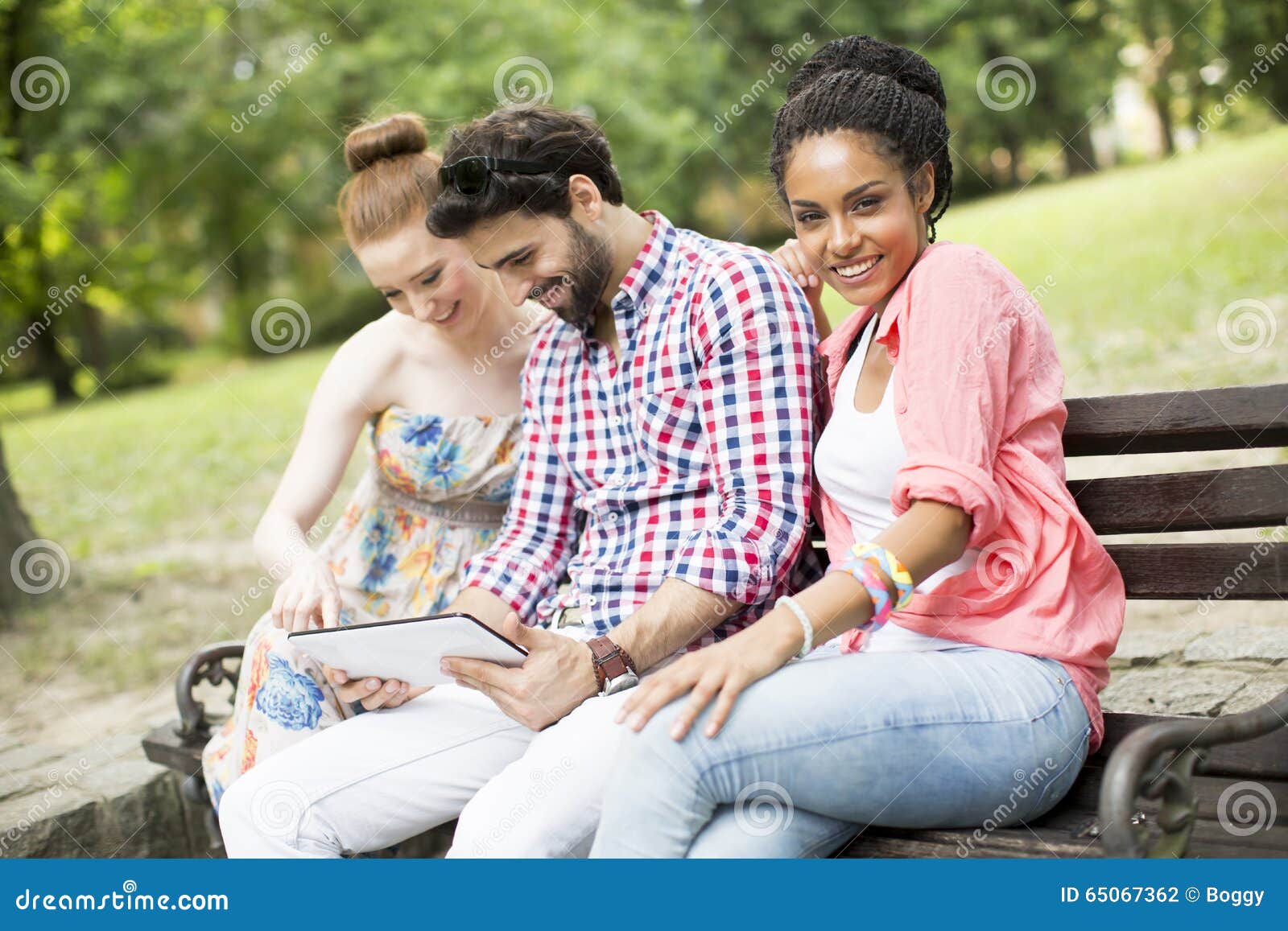 Friends on the Bench with Tablet Stock Photo - Image of pretty, ethnic ...