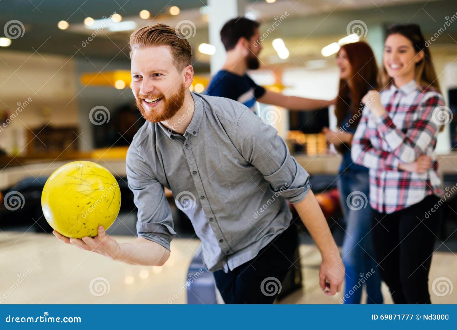 Friends bowling at club stock image. Image of female - 69871777