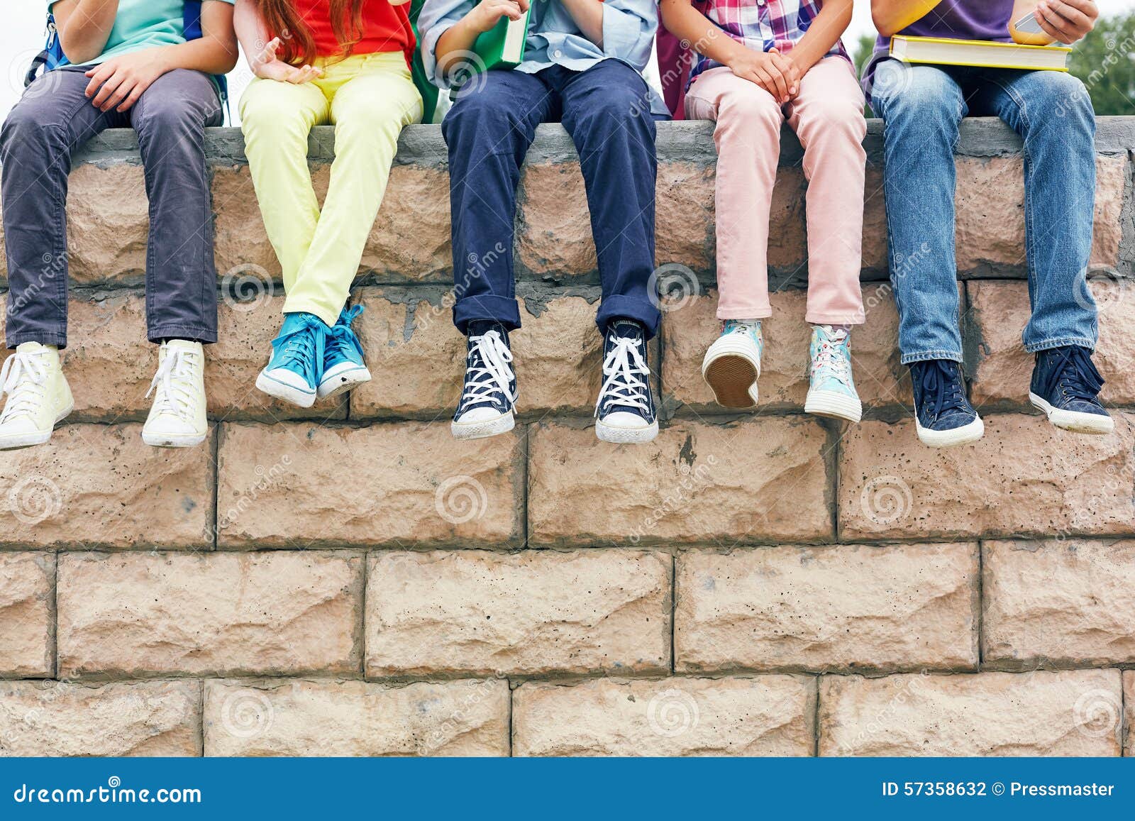 Friends on brick wall stock photo. Image of human, casual - 57358632