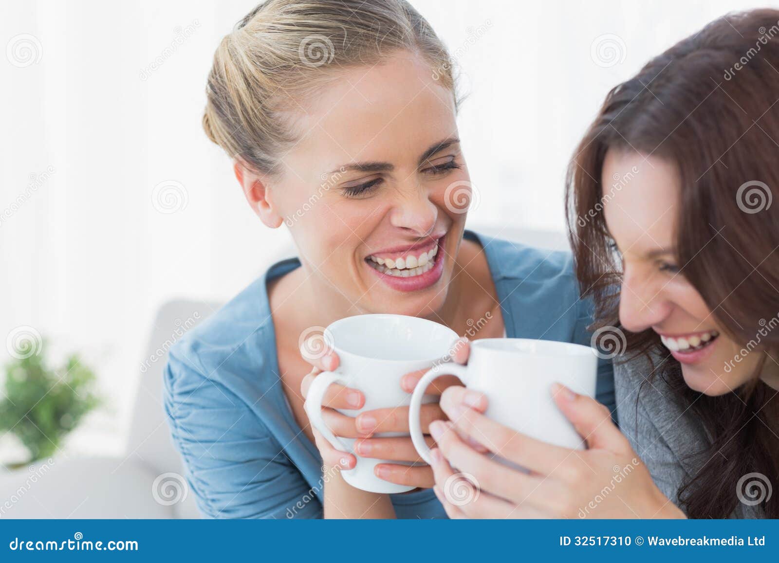 Friends Bursting Out Laughing while Having Coffee Stock Photo - Image ...