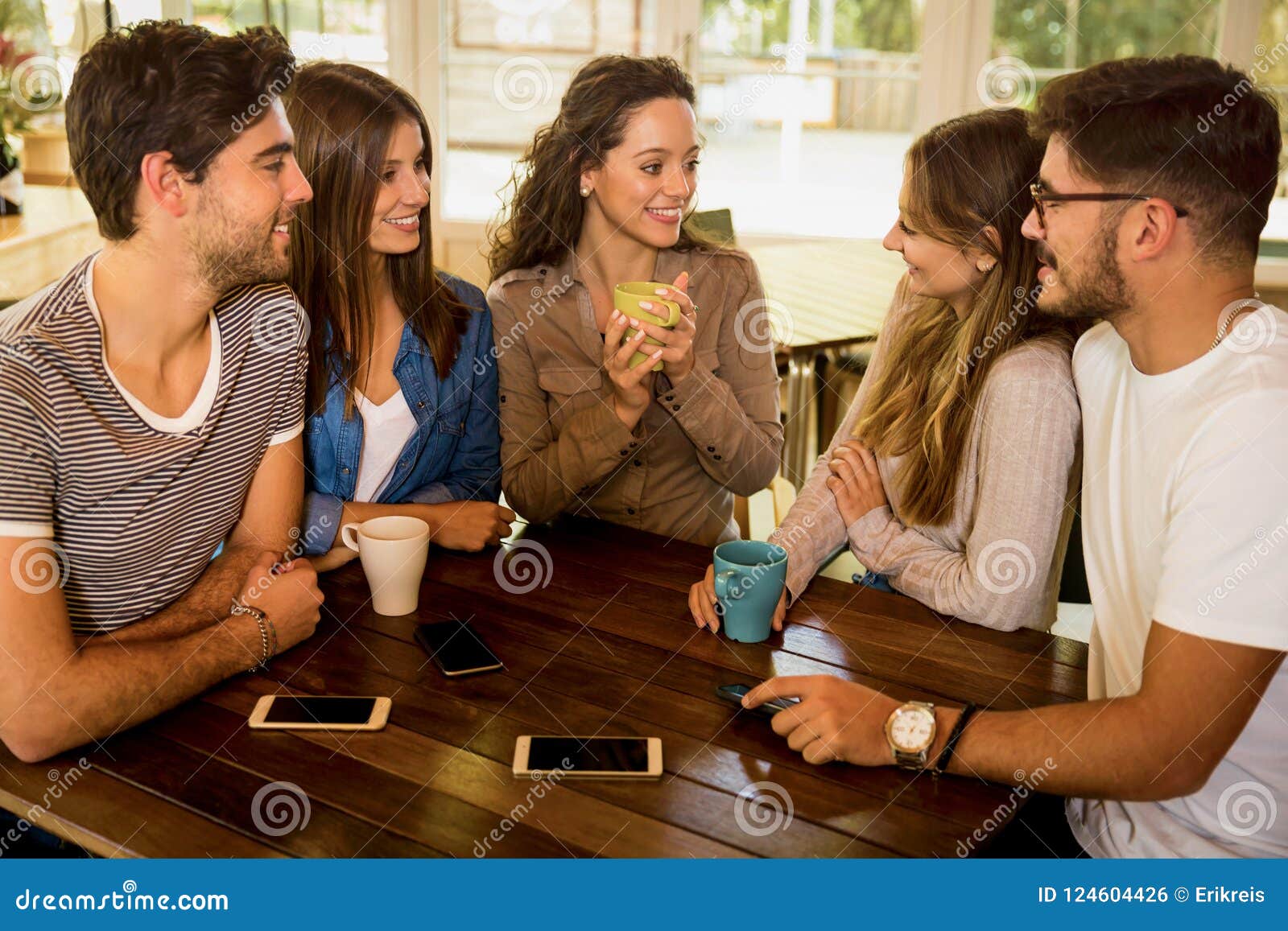 Friends at the cafe stock photo. Image of hispanic, interior - 124604426