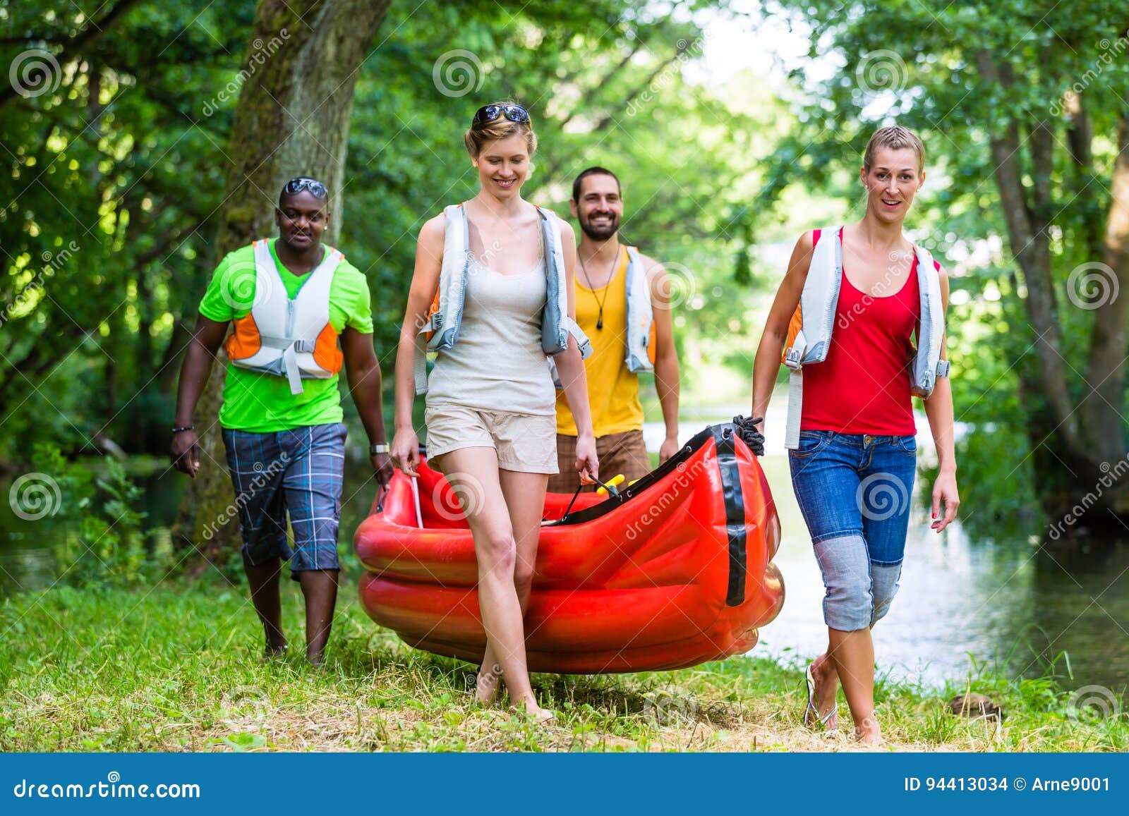 Friends Carrying Kayak To River in Forest Stock Photo - Image of summer ...