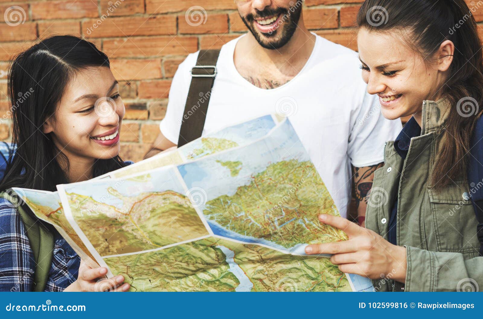 Friends Checking the Map for Directions Stock Photo - Image of ...