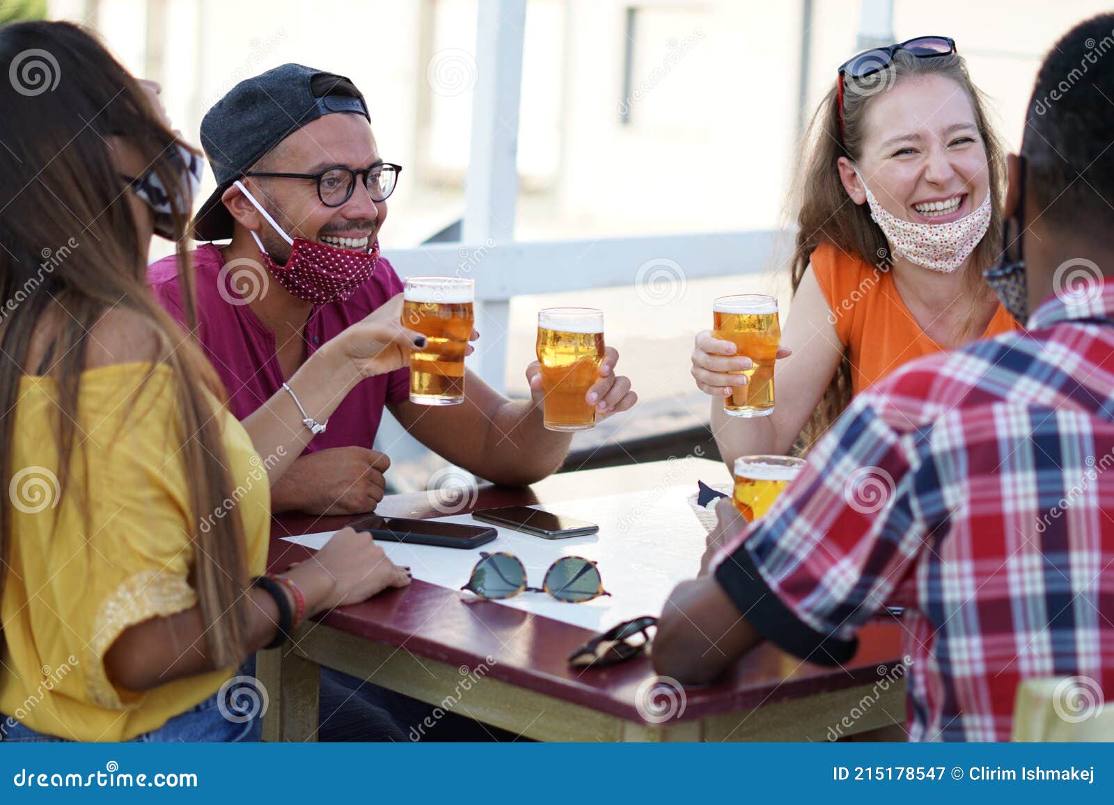 Friends Cheering with Beer and Smiling Laughing with Each Other Stock ...