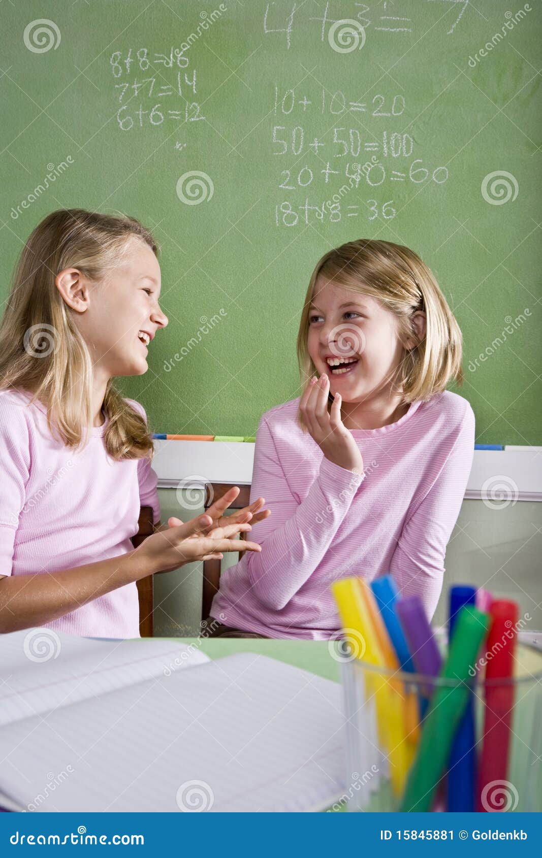 Friends in class talking stock image. Image of elementary - 15845881