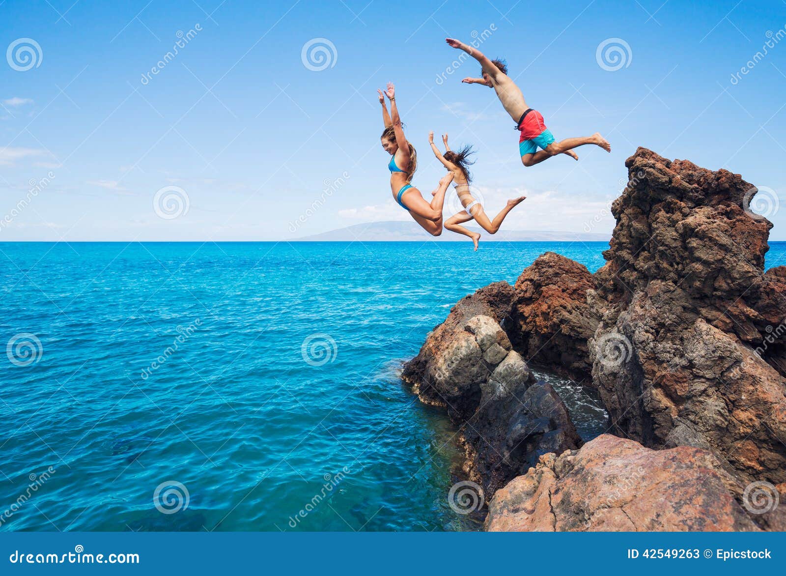 Friends Cliff Jumping into the Ocean Stock Image - Image of action ...