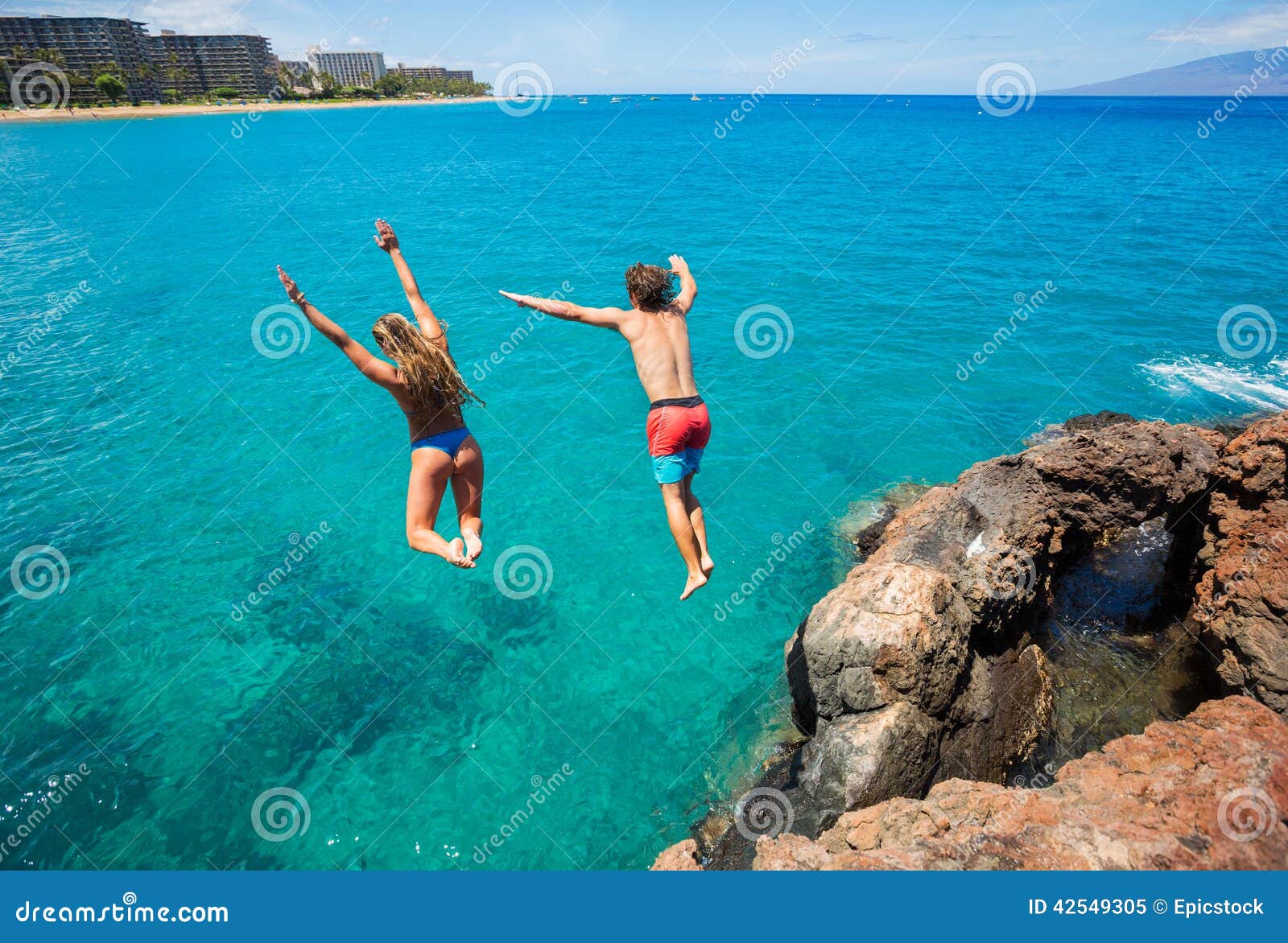 Friends Cliff Jumping into the Ocean Stock Image - Image of landscape ...