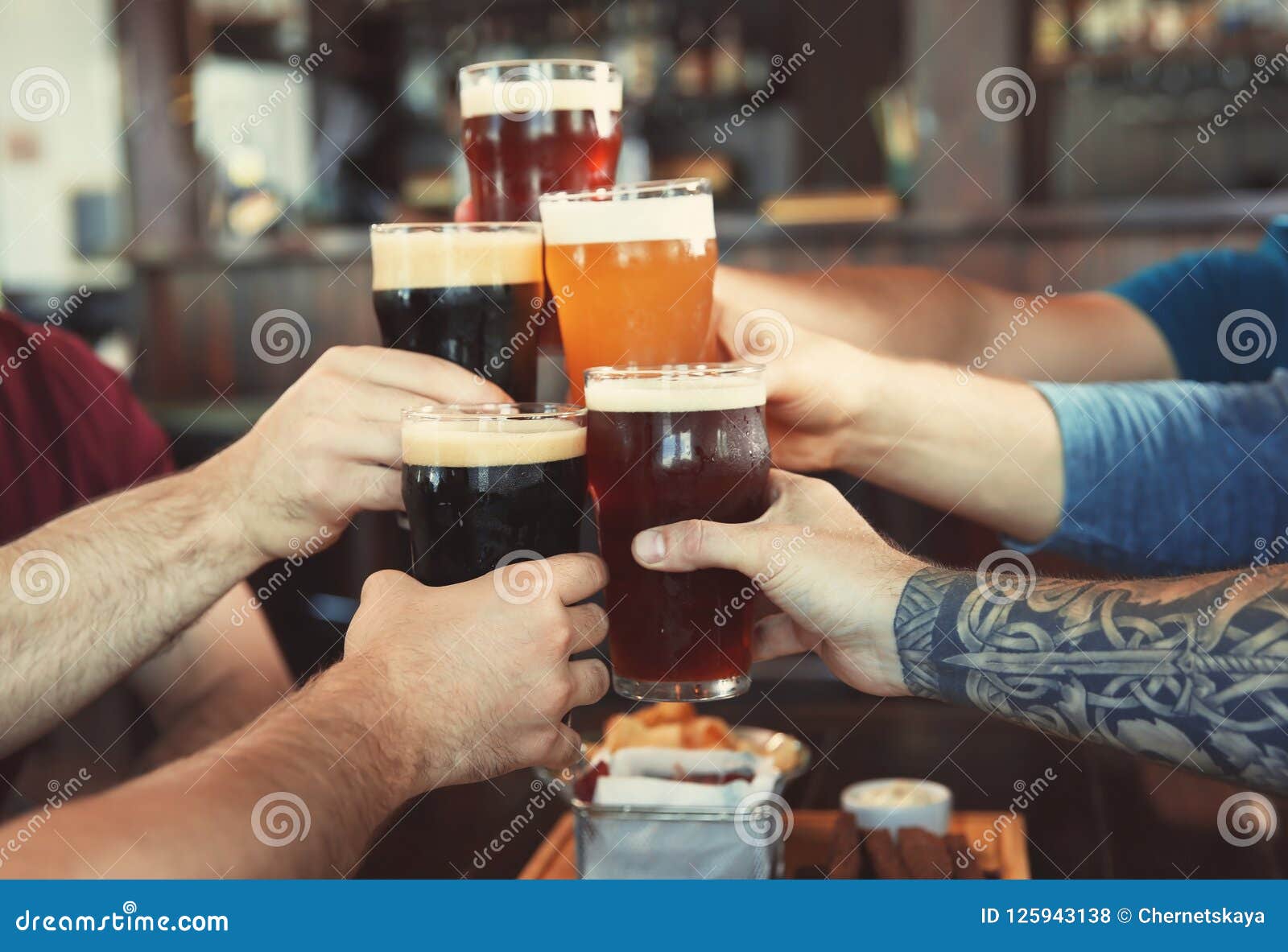 Friends Clinking Glasses with Beer Stock Photo - Image of adult, male ...