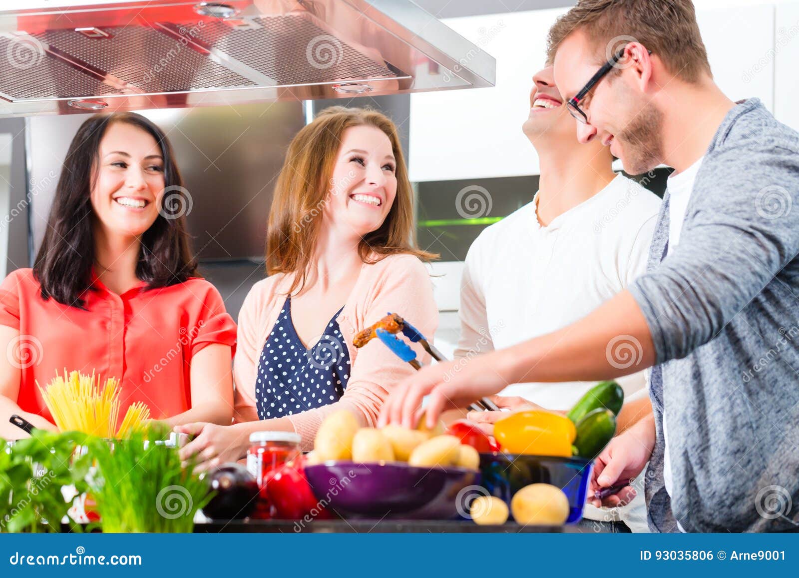 Friends Cooking Pasta and Meat in Domestic Kitchen Stock Photo - Image ...