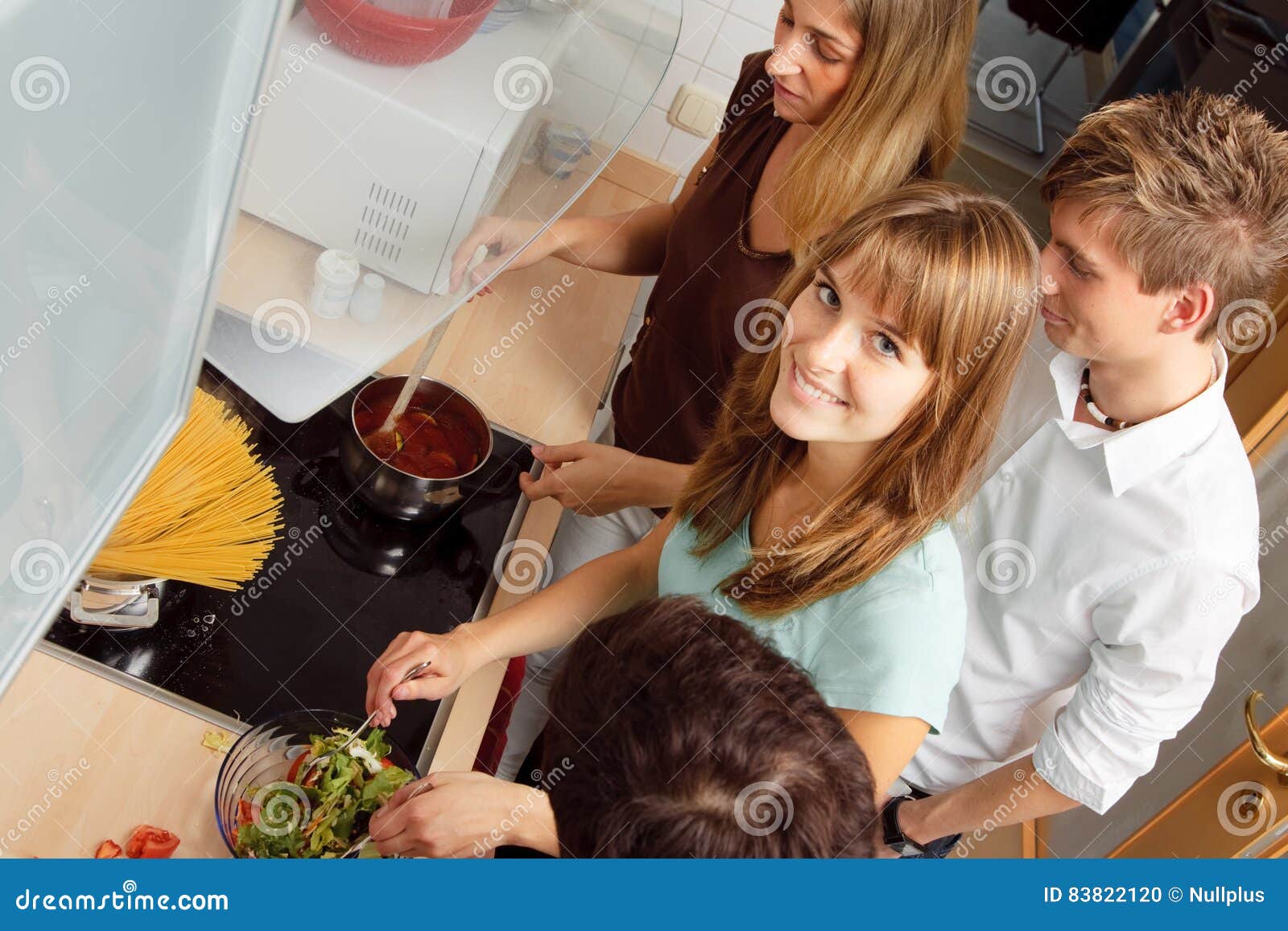 Friends Cooking Together stock photo. Image of event - 83822120