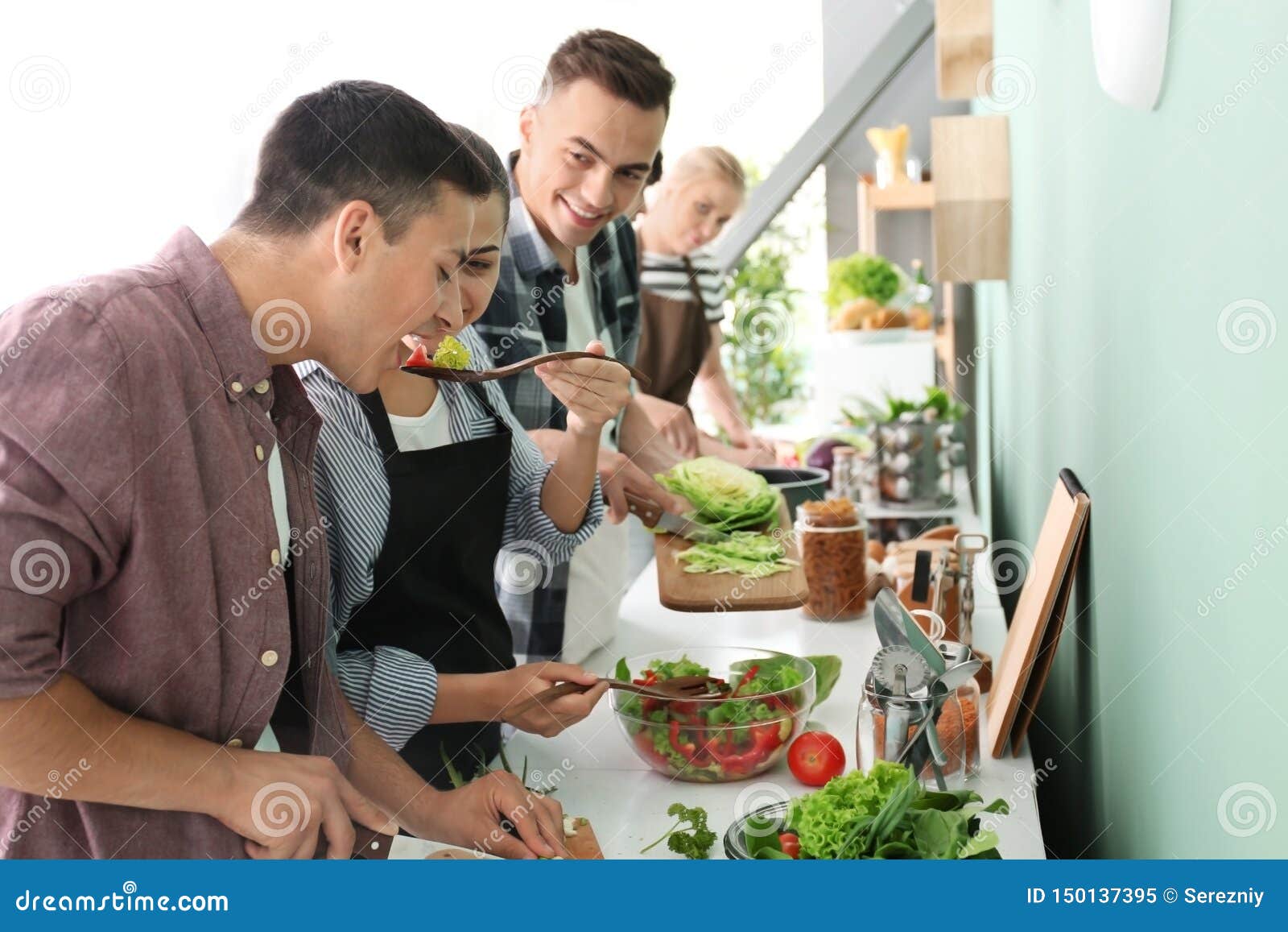 Friends Cooking Together in Kitchen Stock Image - Image of female ...