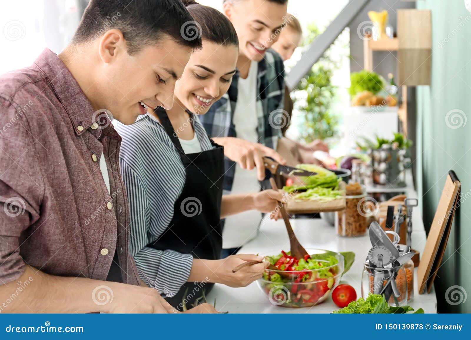 Friends Cooking Together in Kitchen Stock Photo - Image of table ...
